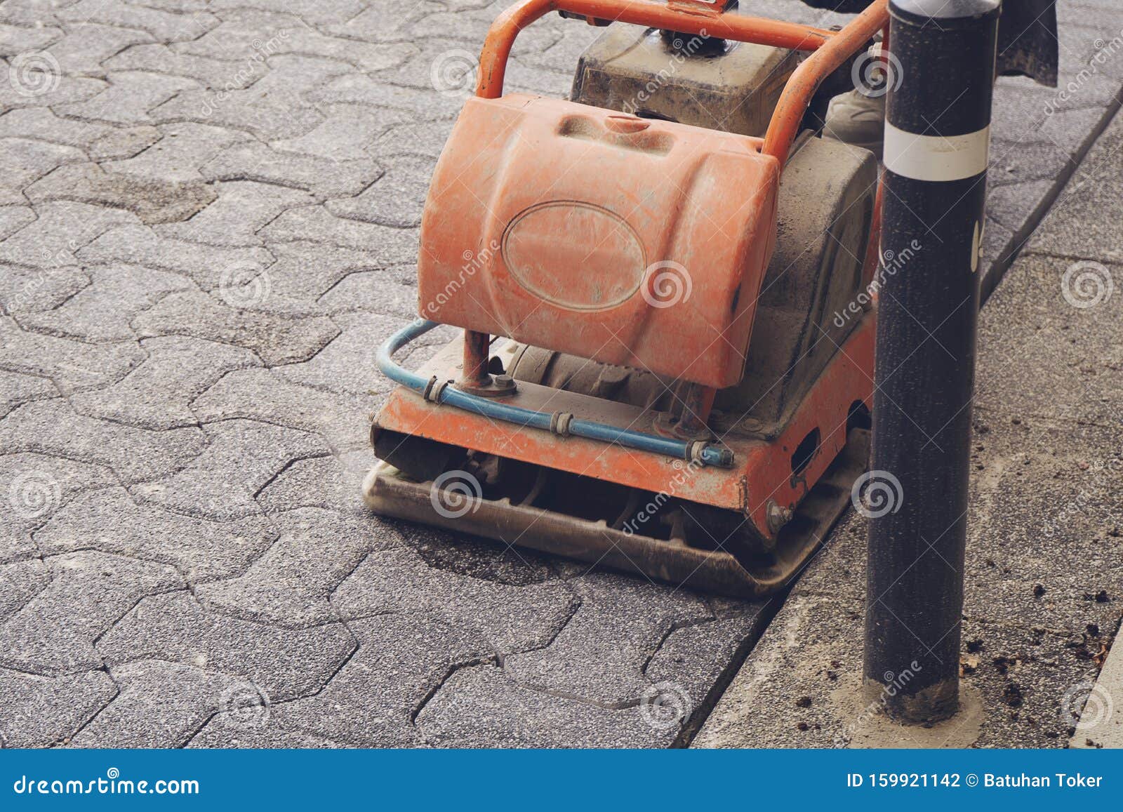 Vibratory Plate Construction Site. Construction Workers Installing and ...
