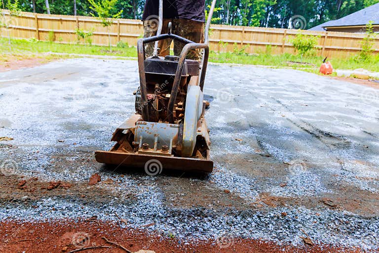 Vibratory Tamping Machine Compacting Sand during Platform Construction ...