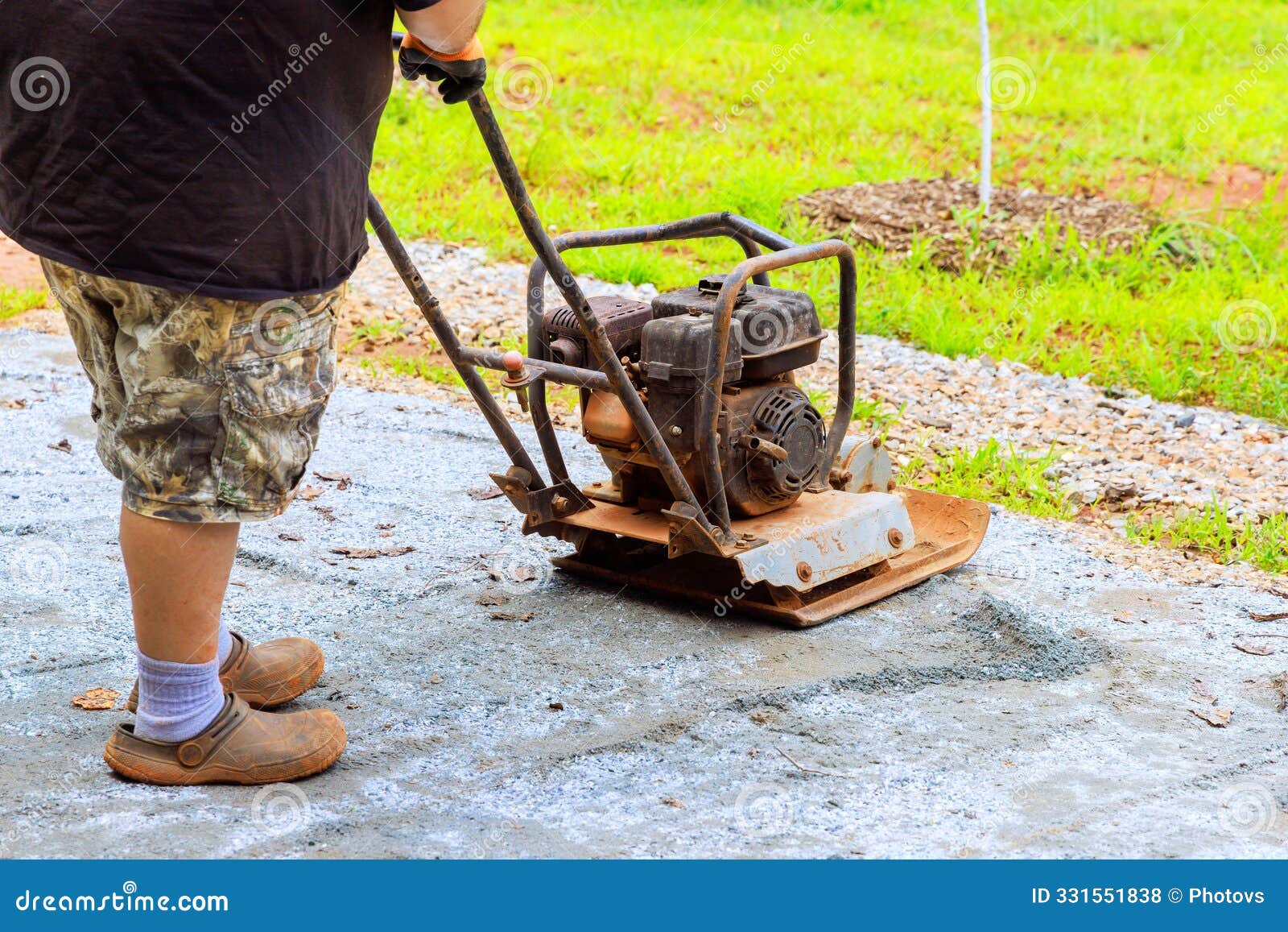 Vibratory Tamping Machine Compacts Sand during Construction of a ...