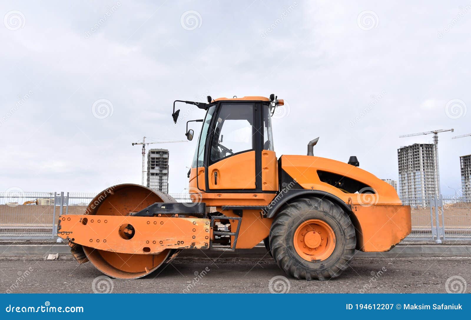 Vibro Roller Soil Compactor Leveling Ground At Construction Site. Tower ...