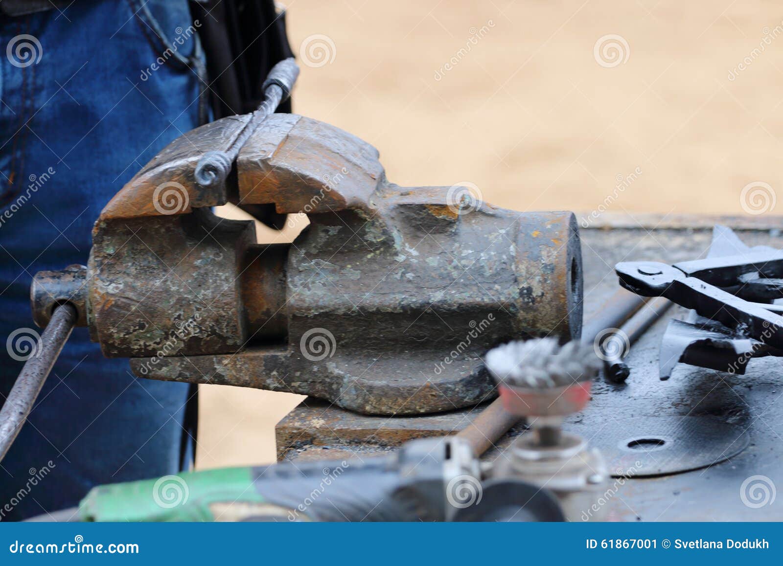 Vice with Metal Forged Object, Blacksmith Tools and Jeans Stock Image ...