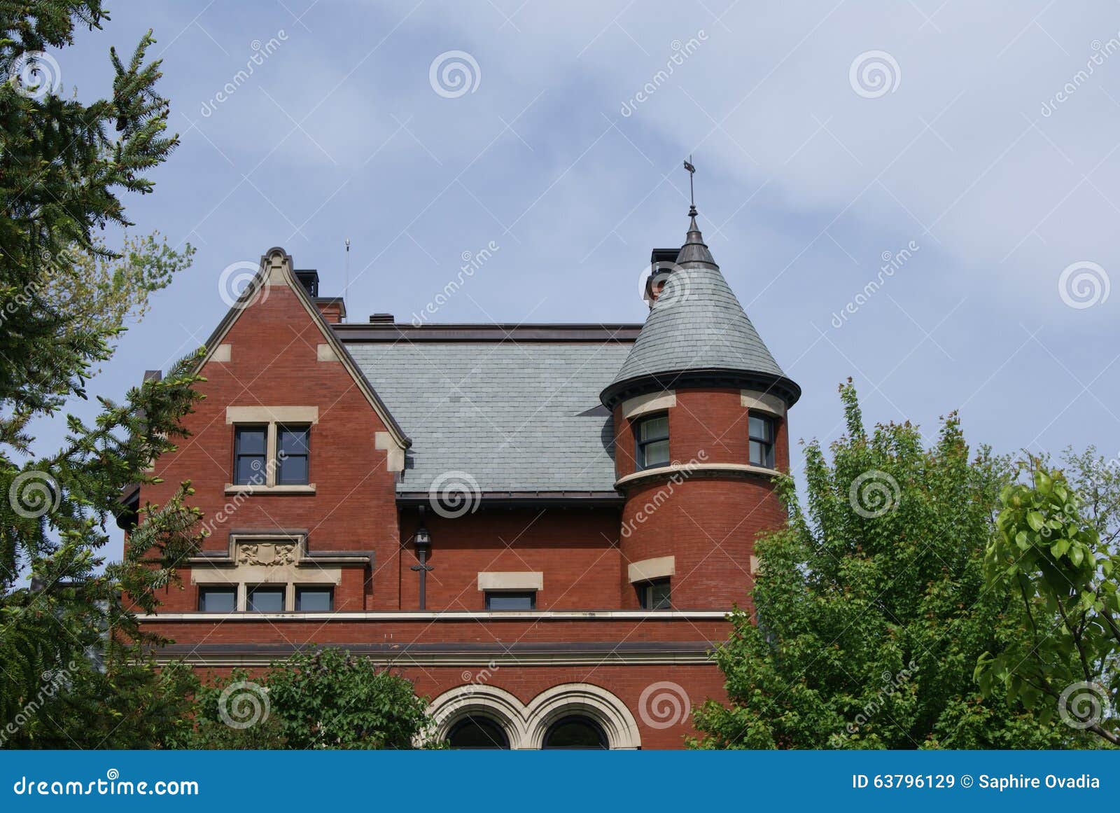 Victorian Turret Roof Set Against Trees And Blue Sky. Royalty-Free ...