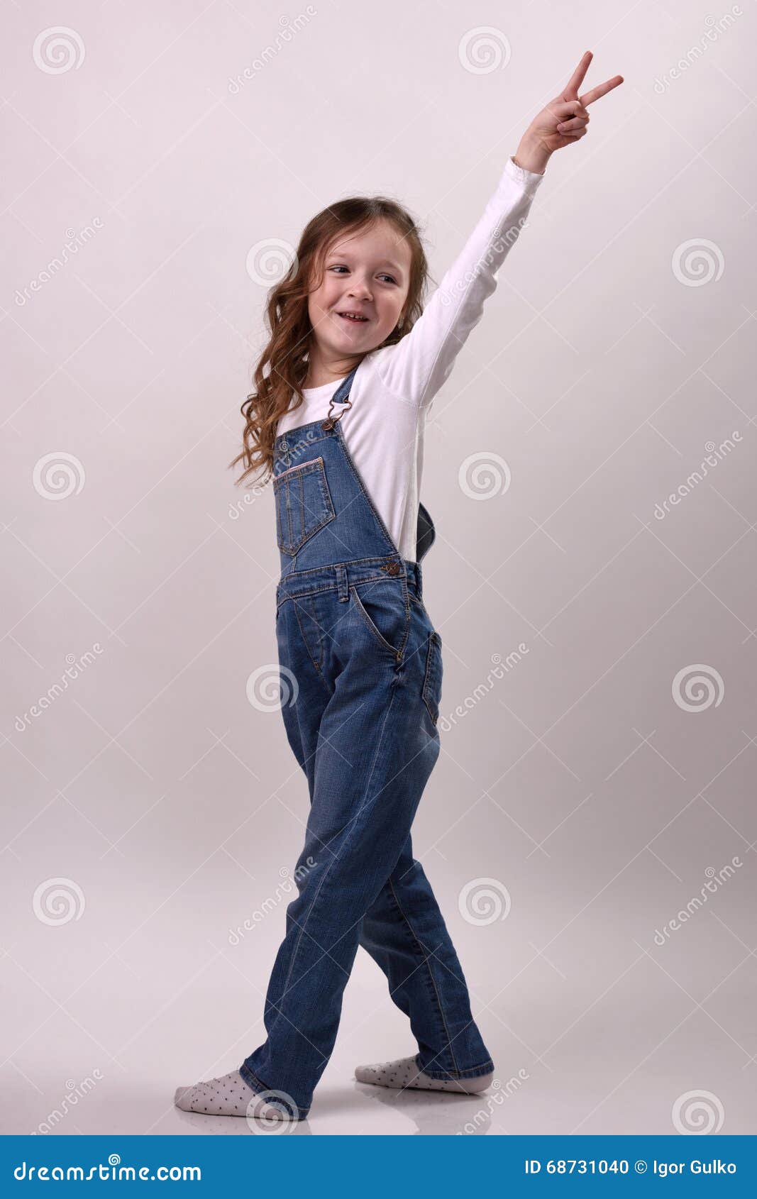 Victory with a smile stock photo. Image of denim, small - 68731040