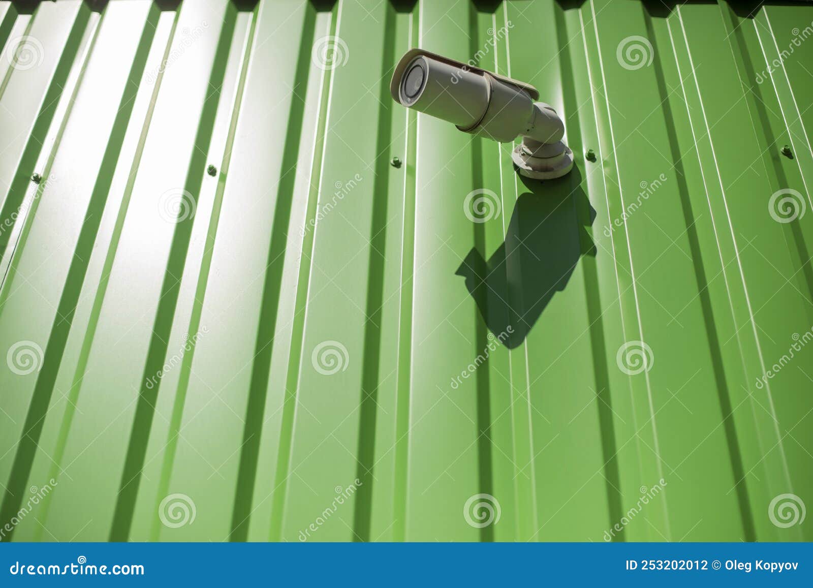 Video Camera on Green Wall. Building Security System Stock Photo ...