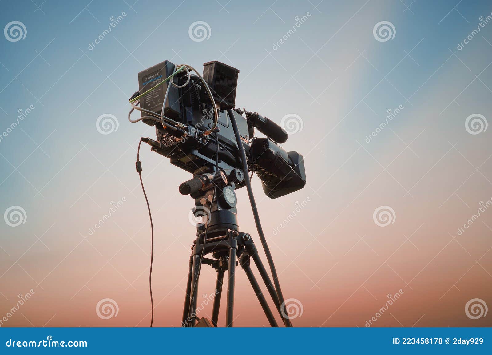 Video Camera on Tripod Over Sunset Sky, TV Professional Studio ...