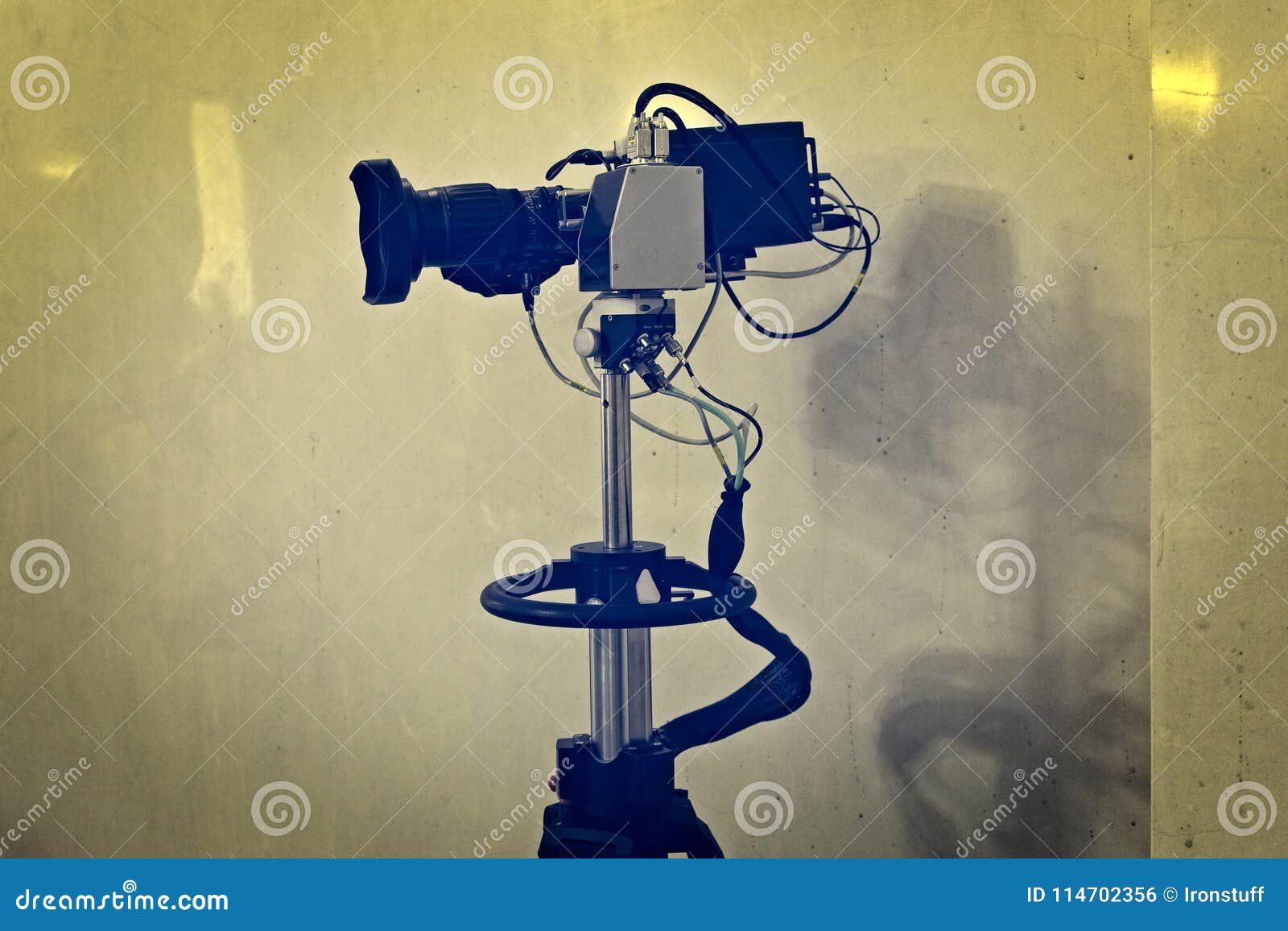 Video camera on a tripod stock photo. Image of equipment - 114702356