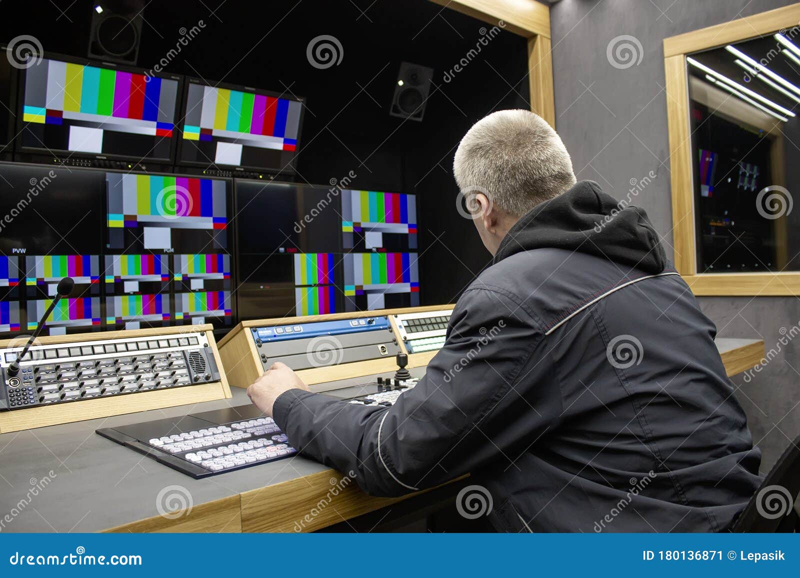 The Video Director Controls the Director`s Console, Turns Knobs and ...