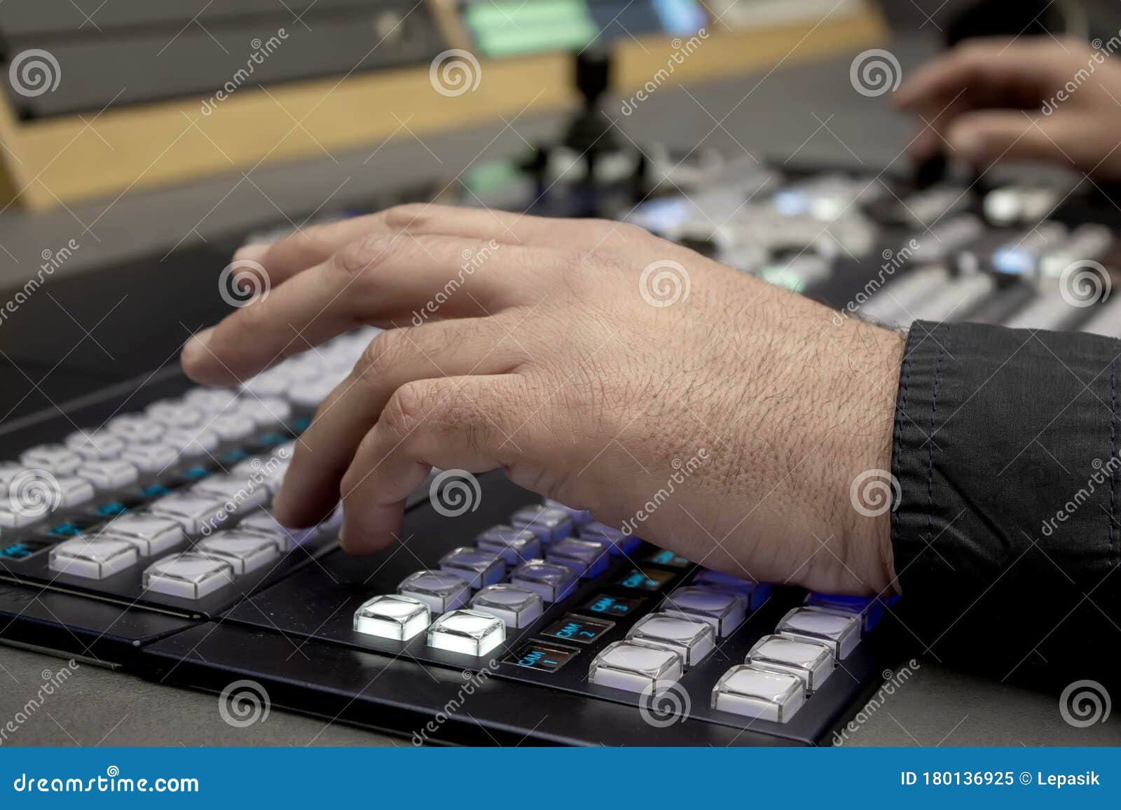 The Video Director Controls the Director`s Console, Turns Knobs and ...