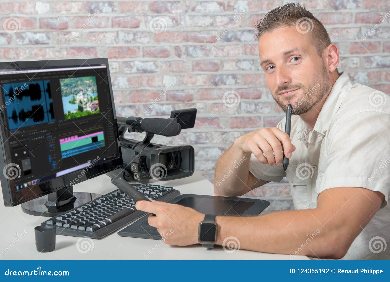 Video Editor with Computer and Professionnal Video Camera Stock Photo ...