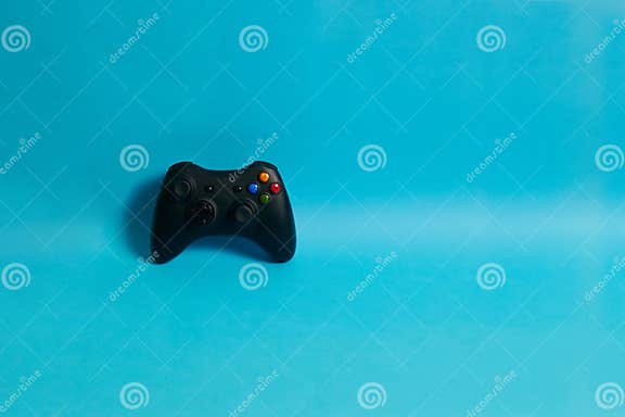 Video Game Console Controller on a Blue Background Stock Photo - Image ...