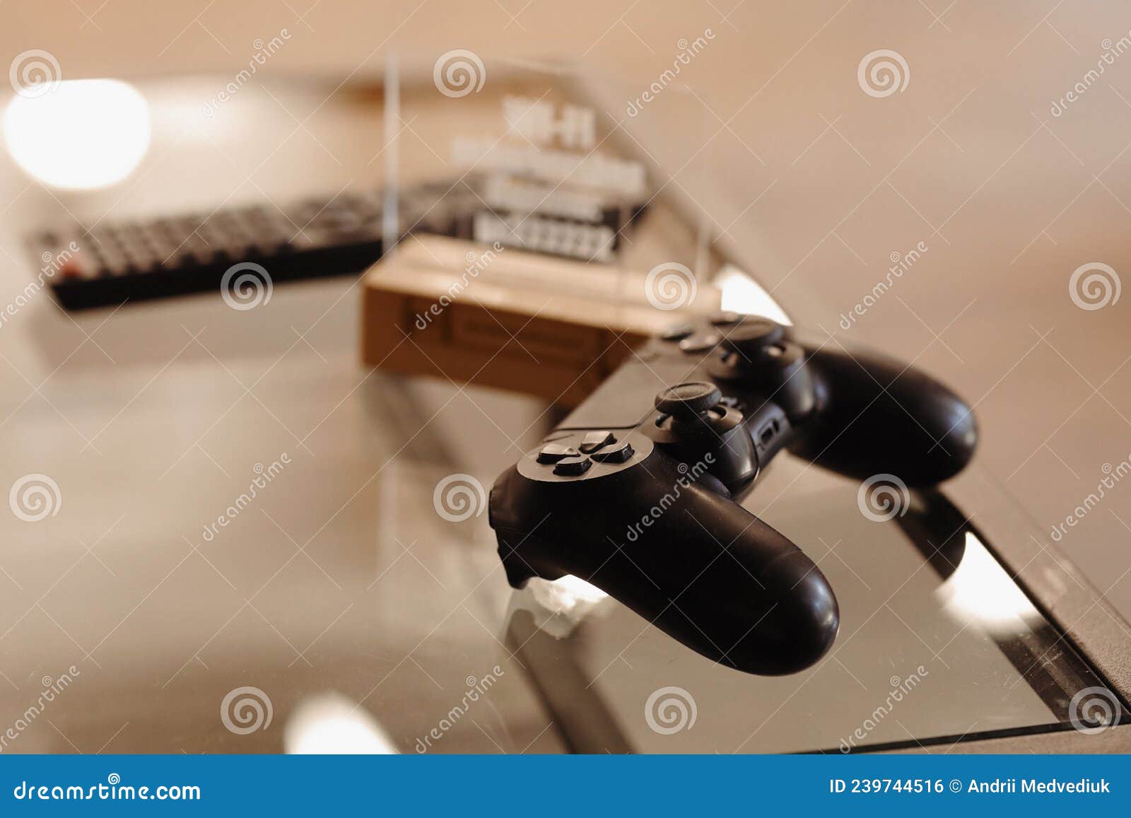 Video Game Controller on Glass Table. Gaming, Technology and ...