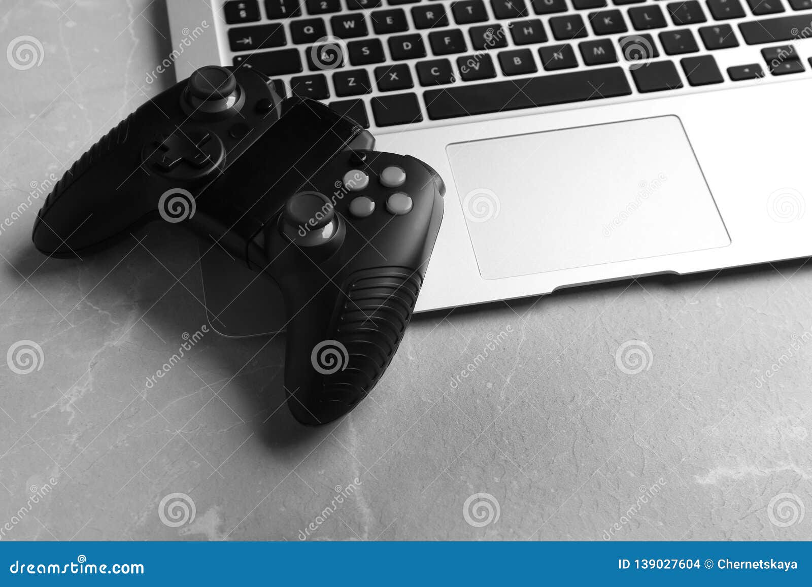 Video Game Controller and Laptop on Table Stock Photo - Image of ...