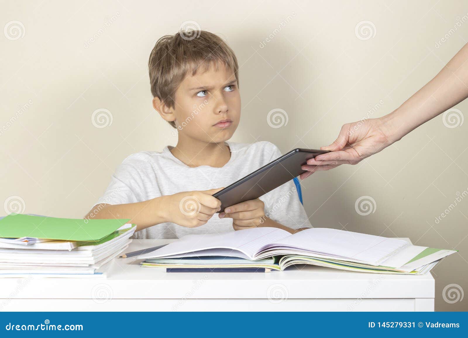 Video Games Addiction. Mother Taking Tablet Away from the Kid Hands ...