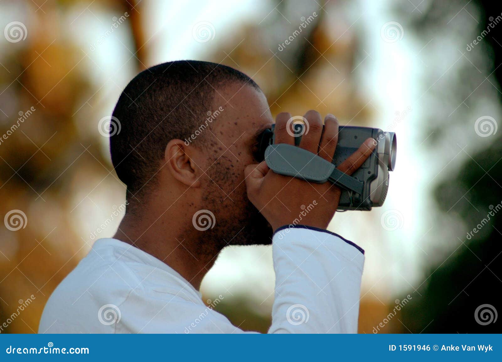 Video man stock photo. Image of afro, filming, camcorder - 1591946