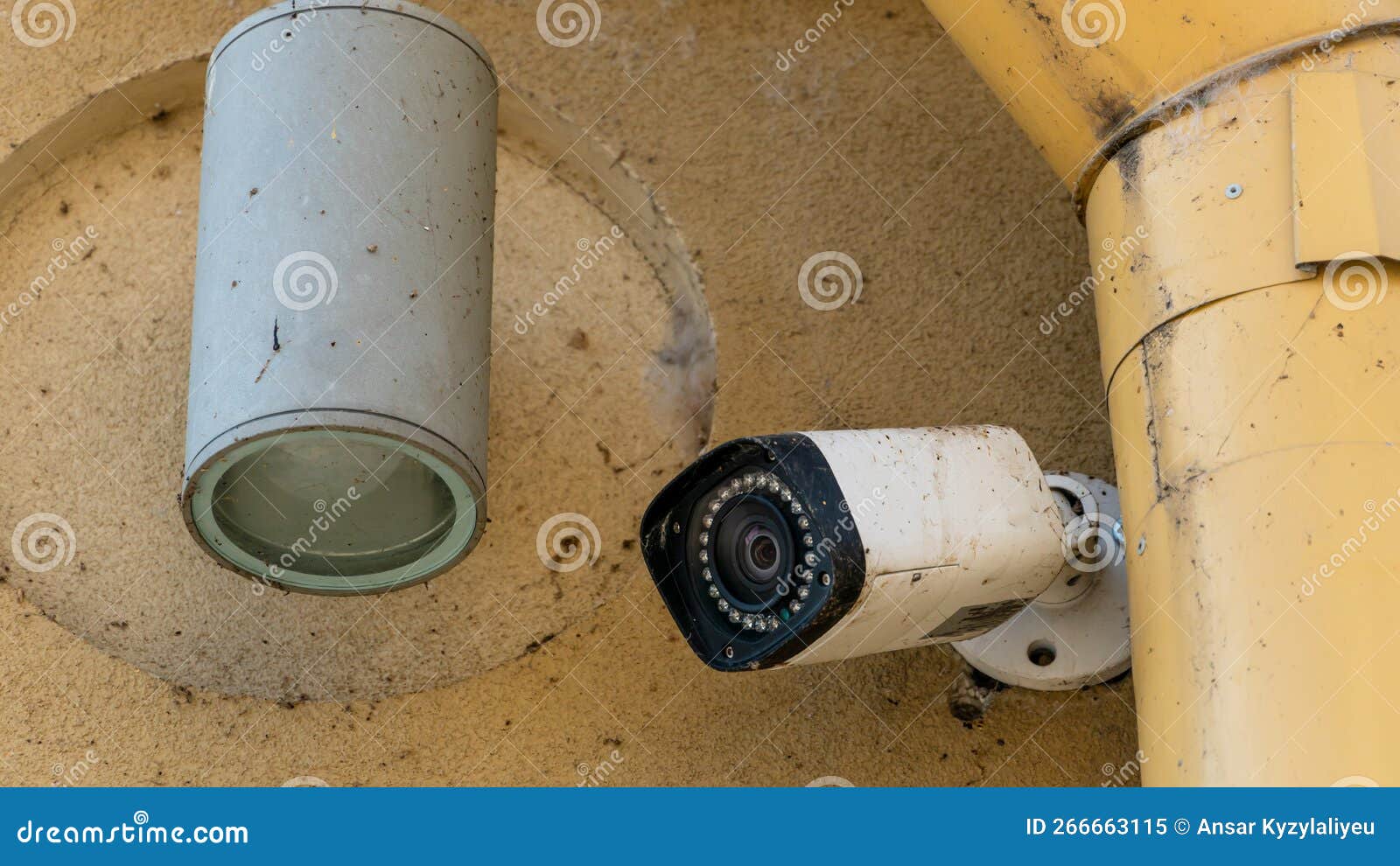 A Video Surveillance Camera is Installed on the Facade of a Building ...