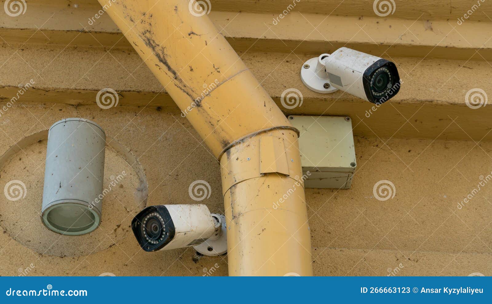 A Video Surveillance Camera is Installed on the Facade of a Building ...