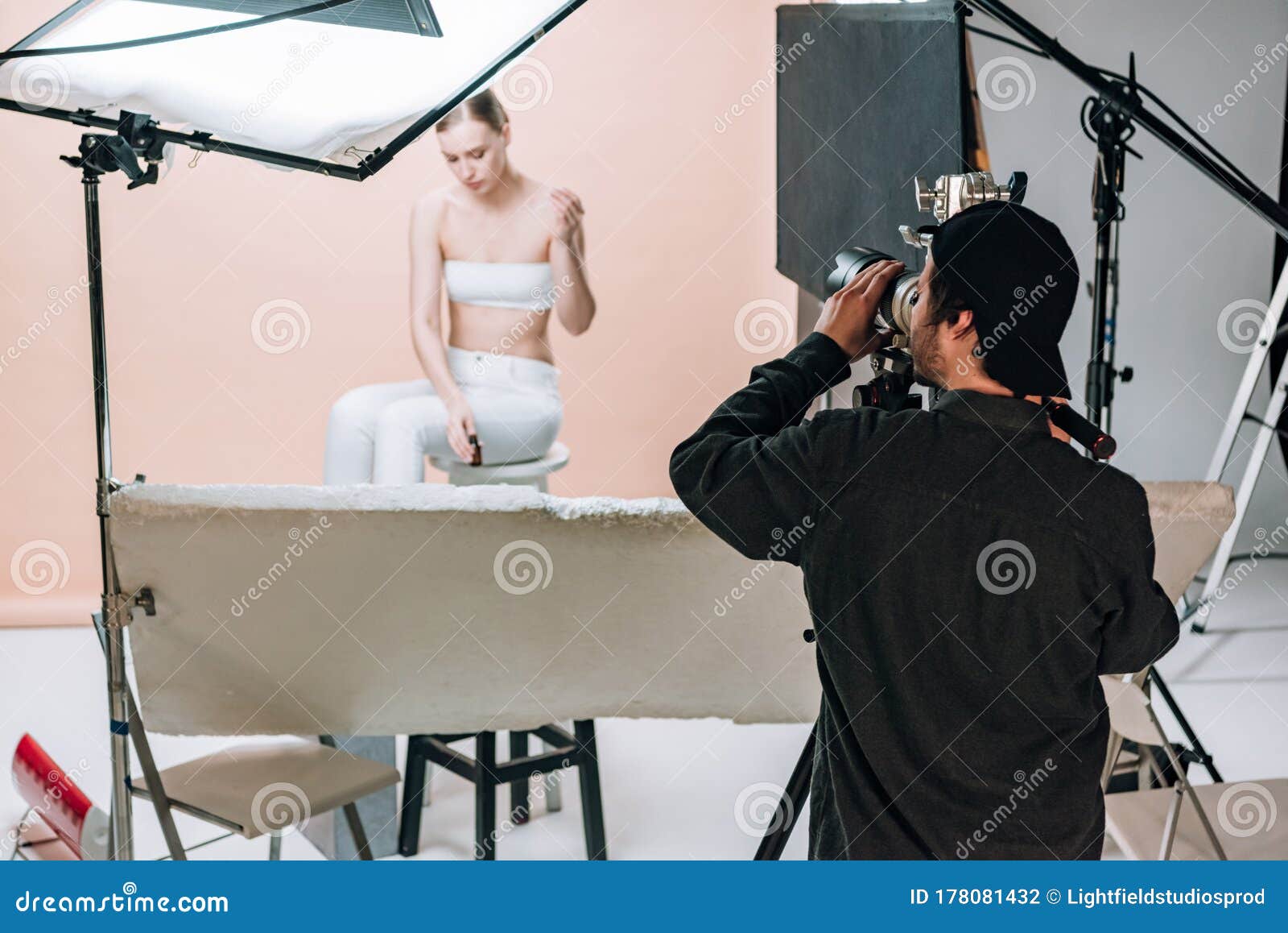 Videographer with Camera Filming Beautiful Model Stock Photo - Image of ...