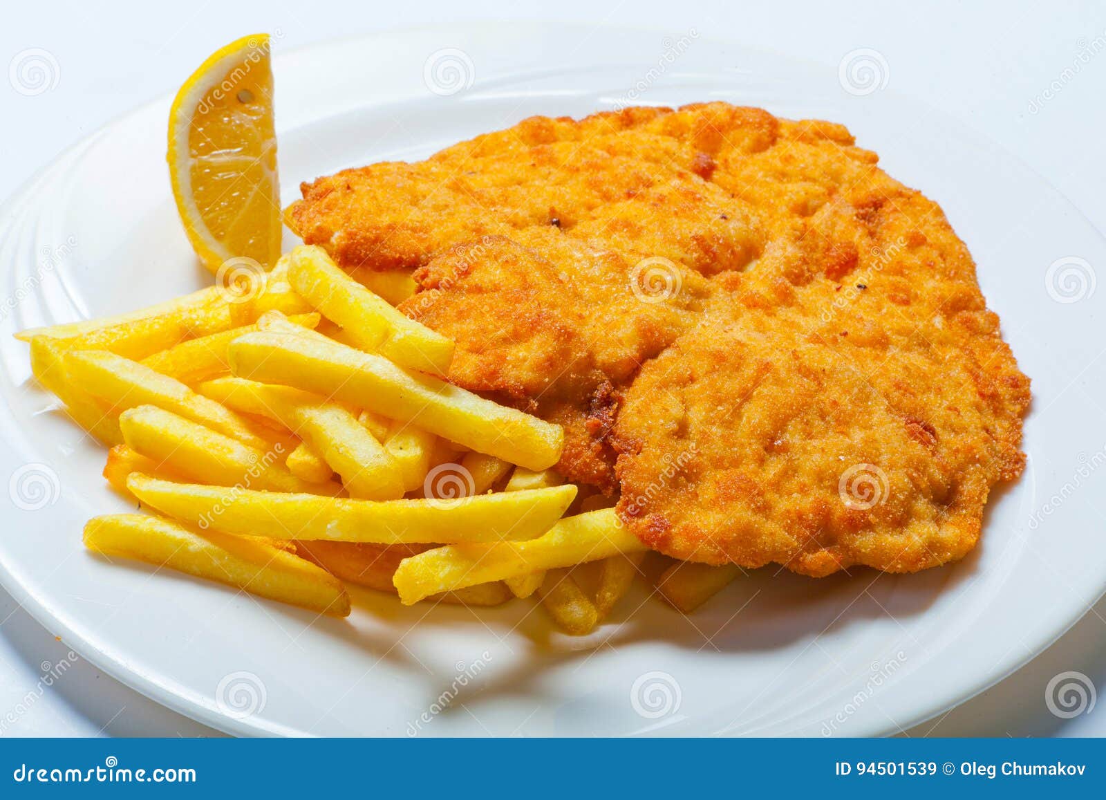 Viennese Schnitzel with Fries on the White Plate Stock Image - Image of ...