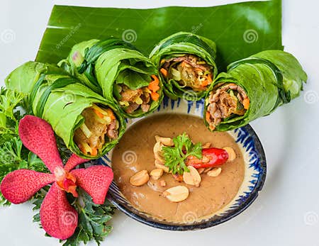 Vietnamese Green Nem Spring Rolls in Leaf with Sauce Stock Photo ...