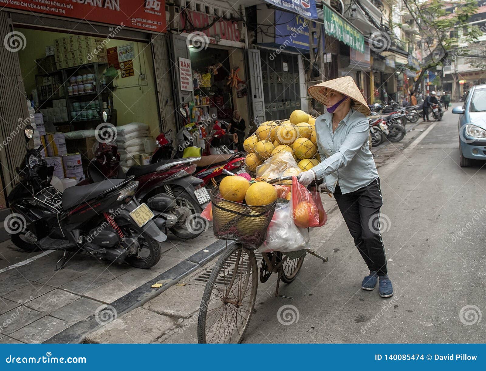 Vietnamese Street Vendor in Hanoi, on Bicycle Carrying Goods for Sale ... Vietnamese Street Vendor in Hanoi, on Bicycle Carrying Goods for Sale ...