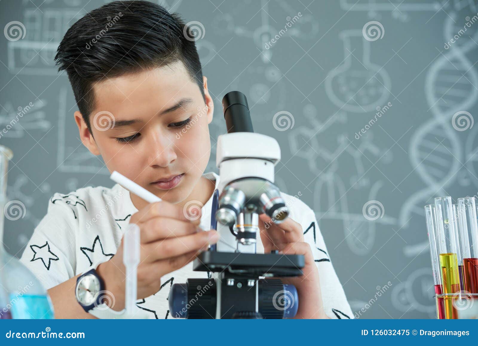 Student with microscope stock image. Image of laboratory - 126032475