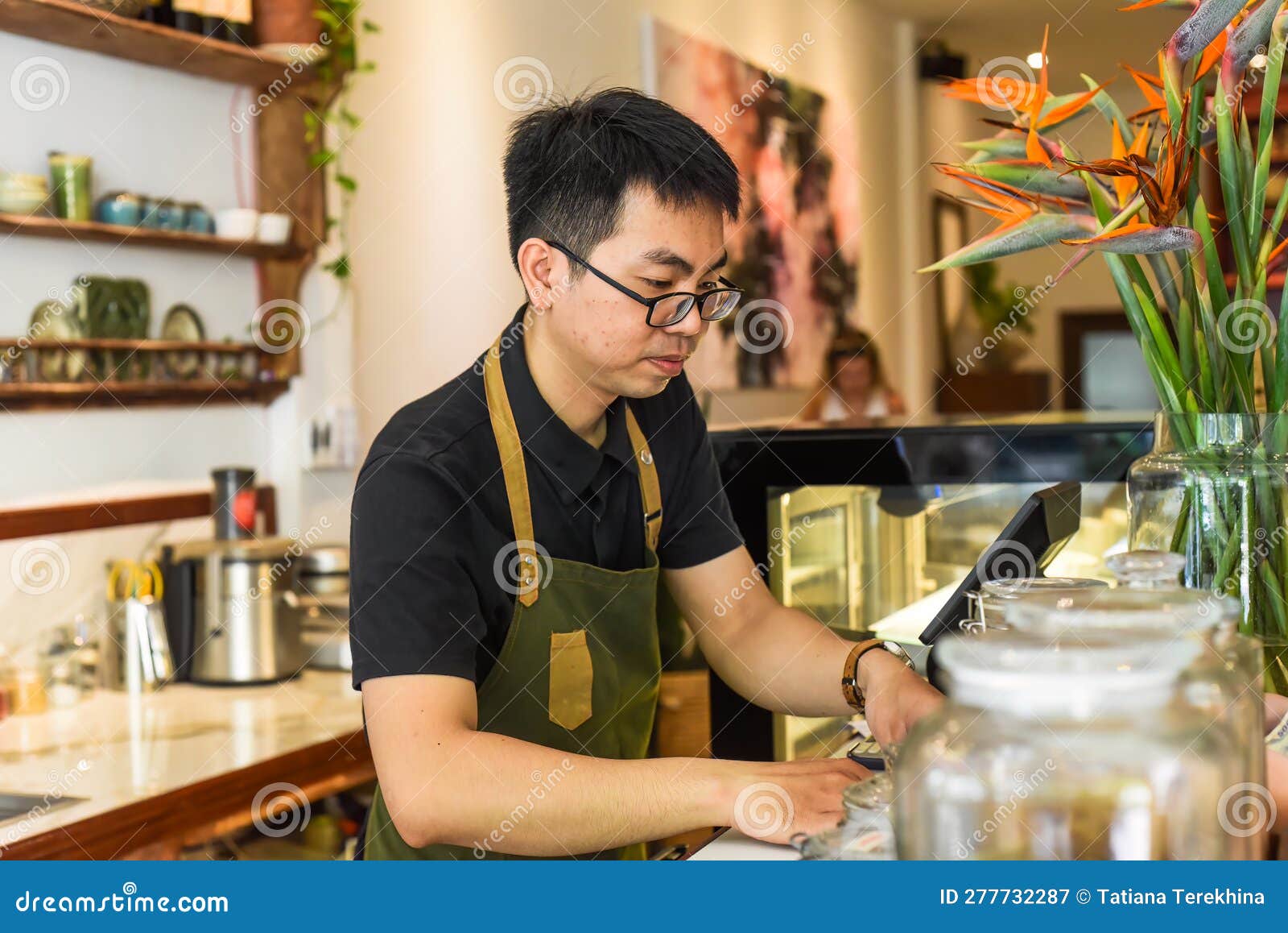 Vietnamese Waiter Working in Counter with Cashier Machine in a Cafe ...