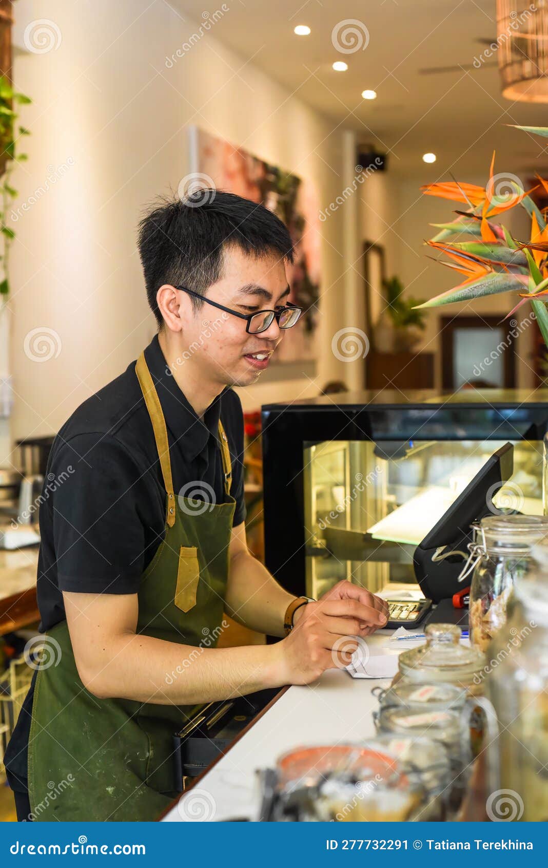 Vietnamese Waiter Working in Counter with Cashier Machine in a Cafe ...