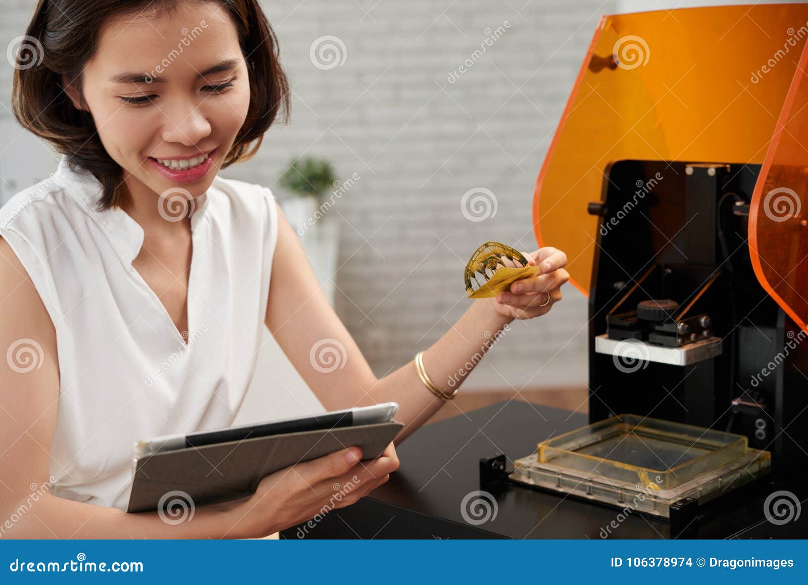 Woman using 3D printer stock photo. Image of detail - 106378974