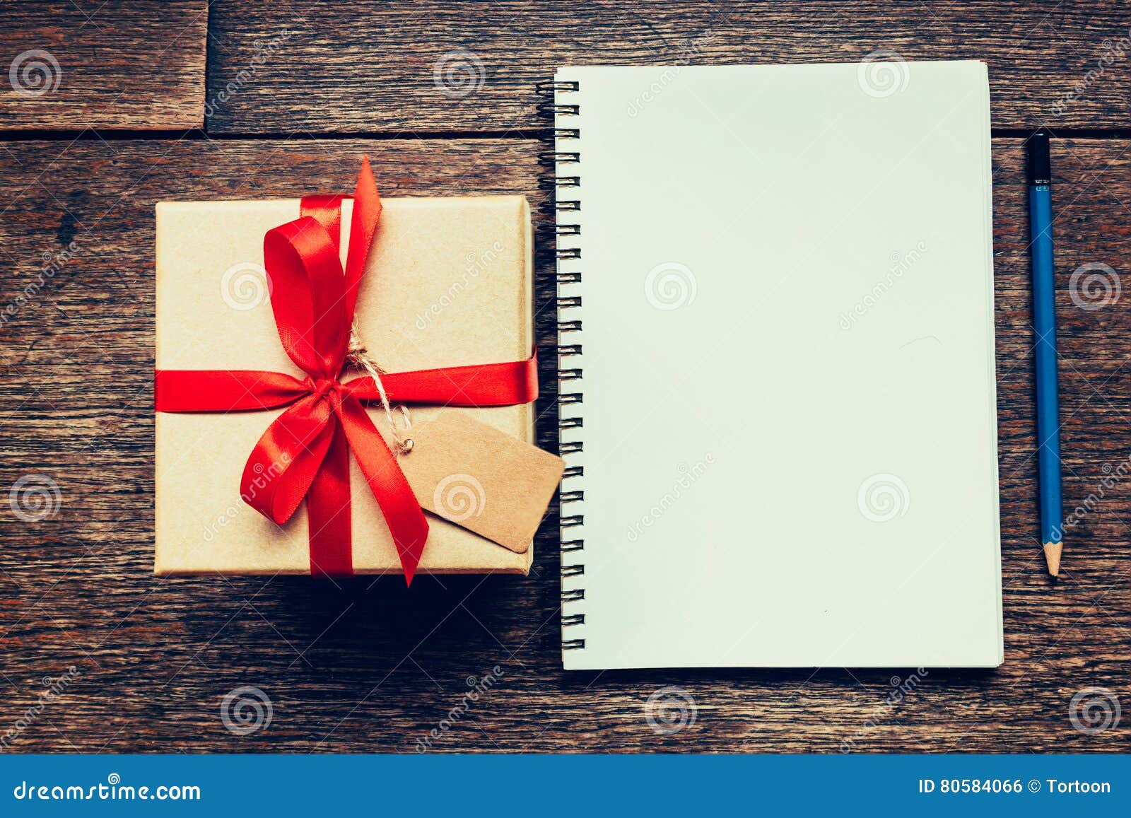 View Above Brown Gift Box and Notebook with Tag on Wood Background with ...