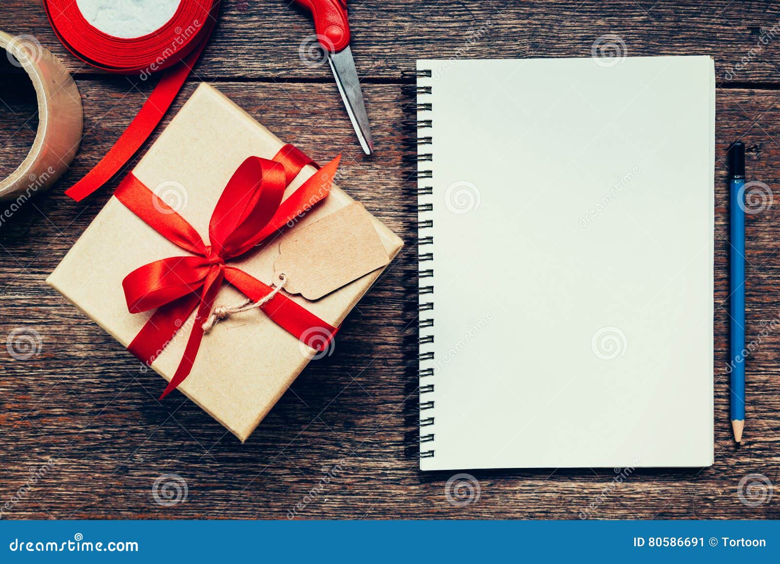 View Above Brown Gift Box and Notebook with Tag on Wood Background with ...