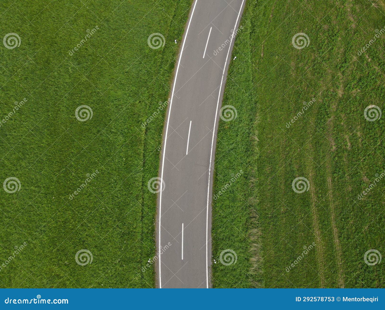 View from Above of a Curved Road between Grass Fields in the Landscape ...