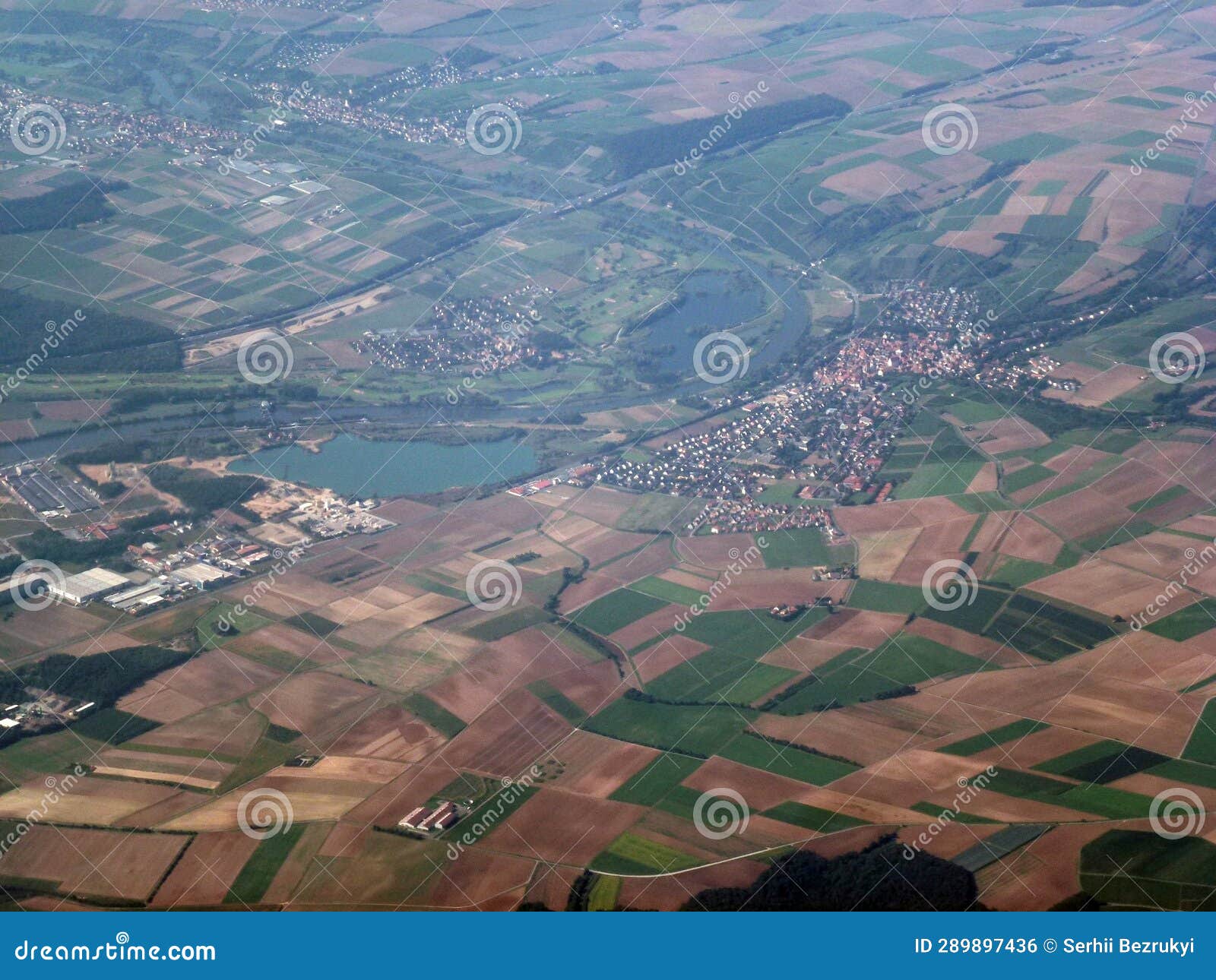 View from Above of Different Colored Fields, Forests and Small Towns ...