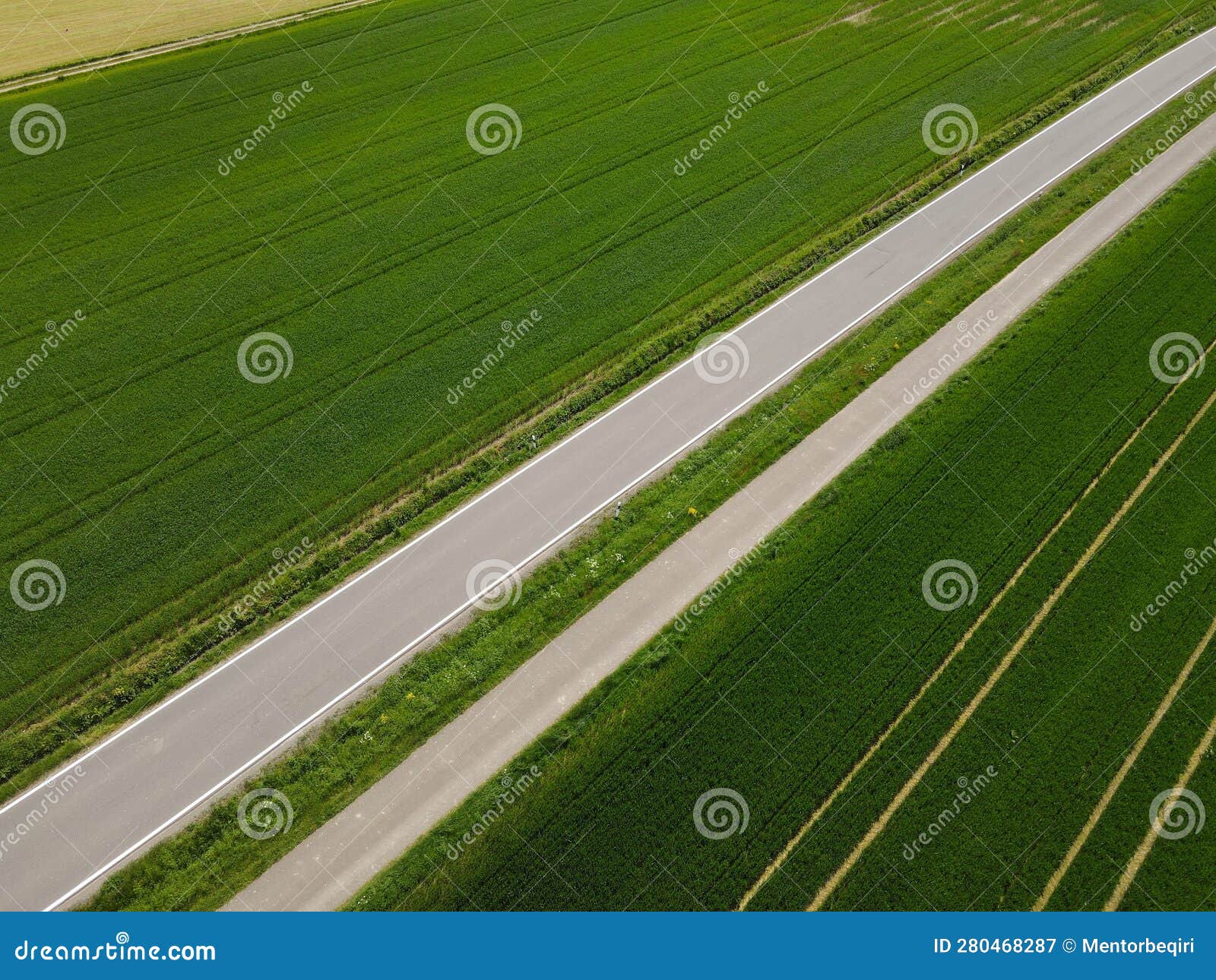 View from Above of an Empty Road and a Bike Path among Growing Wheat ...