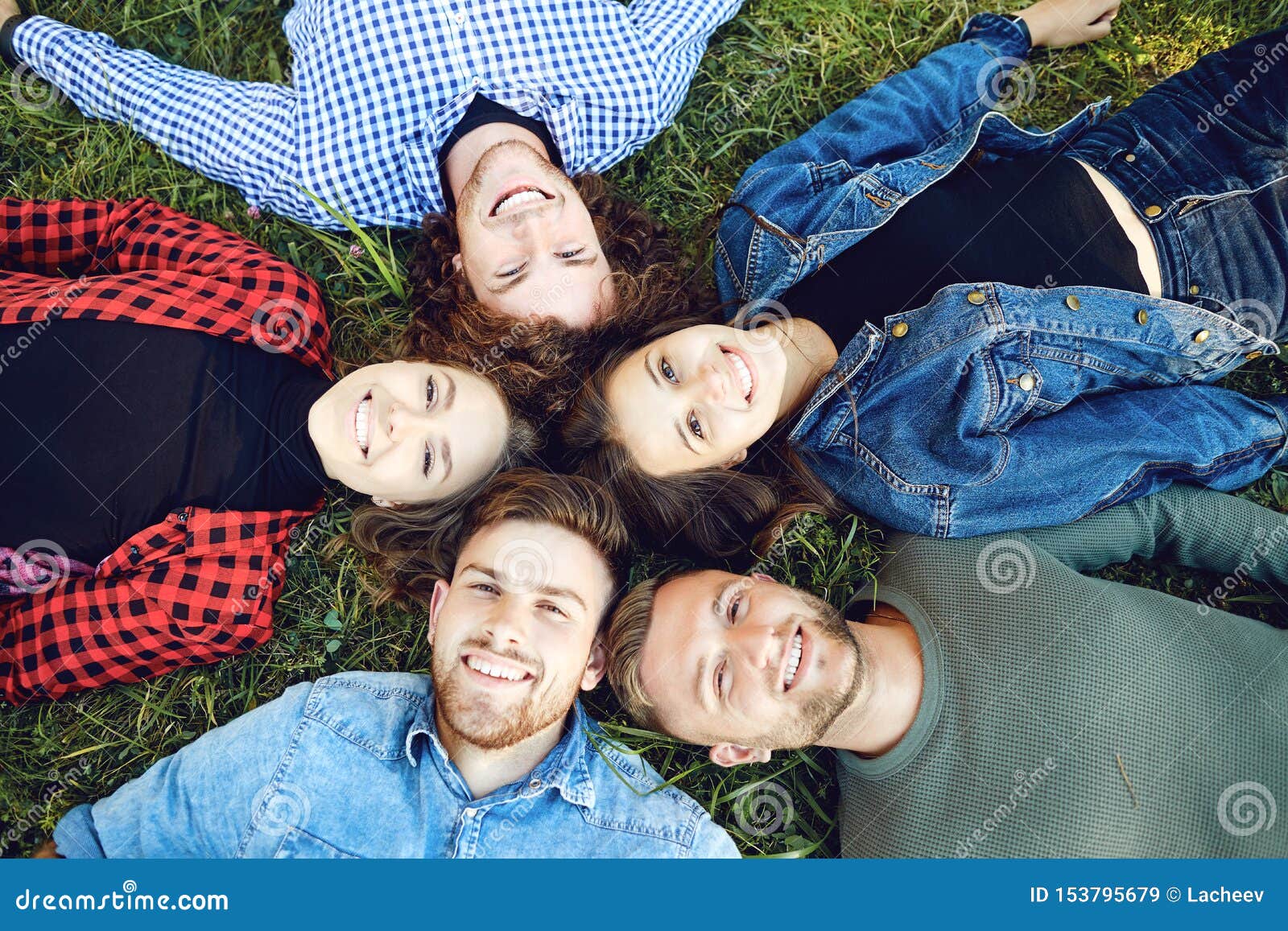 Friends Lie on the Grass in the Park. Stock Image - Image of people ...