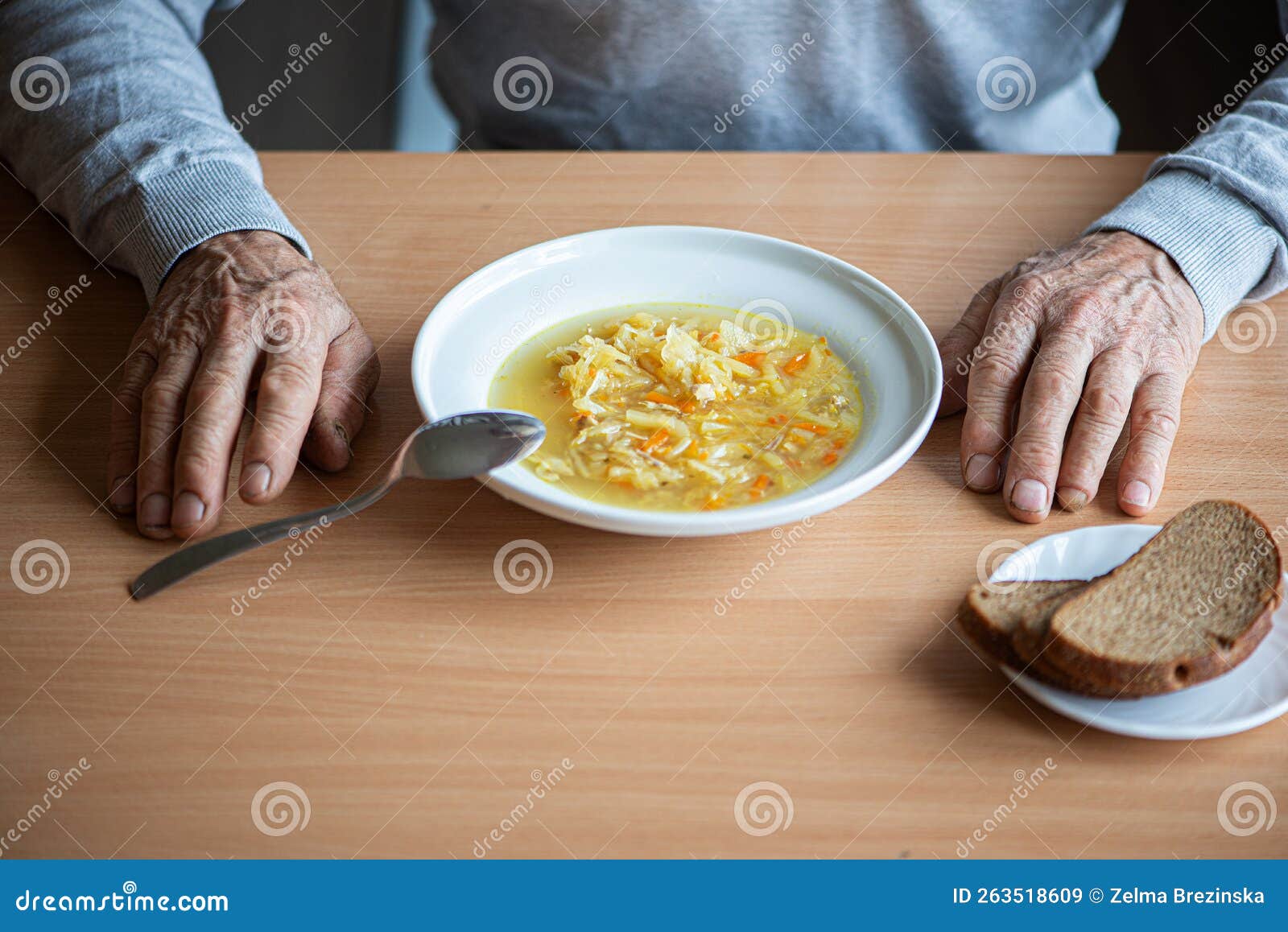 View from Above of a Soup Plate, Bread and the Untidy Hands of an Old ...