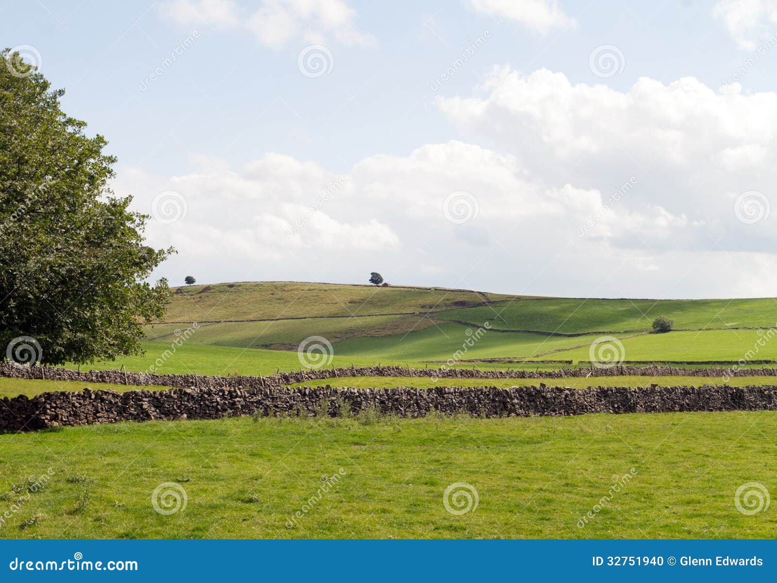 A view across the field stock photo. Image of hill, green - 32751940