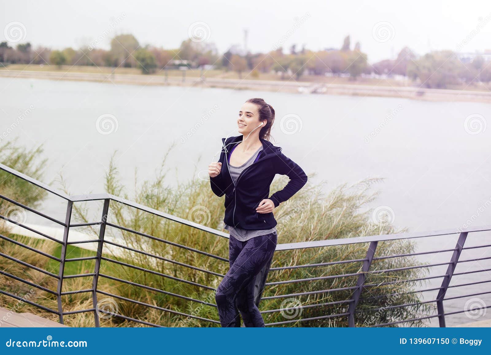 View at Active Young Beautiful Woman Running by River Stock Photo ...