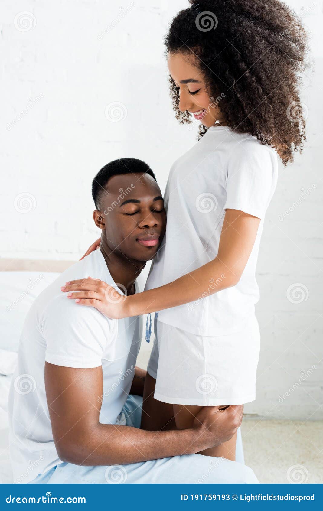 View Of African American Man Hugging With Beautiful Girlfriend Stock