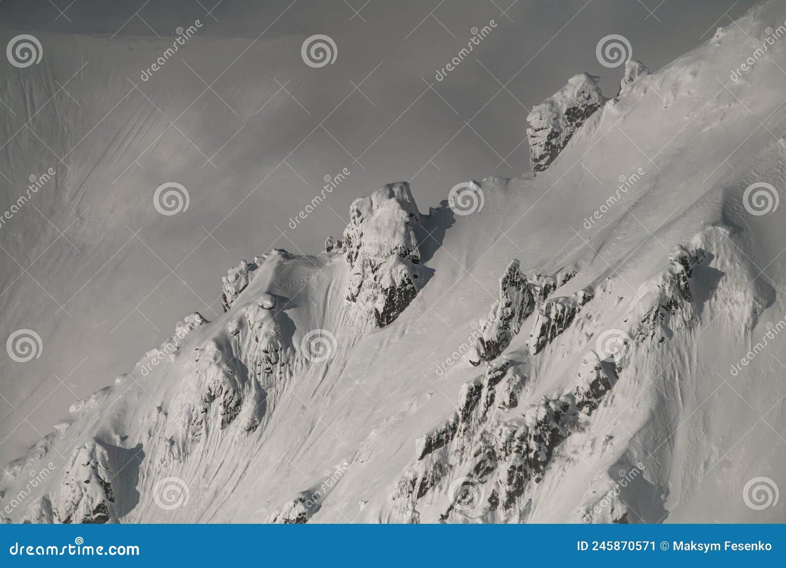 View from Air on Stone Ledge of a Mountain Covered with White Snow ...