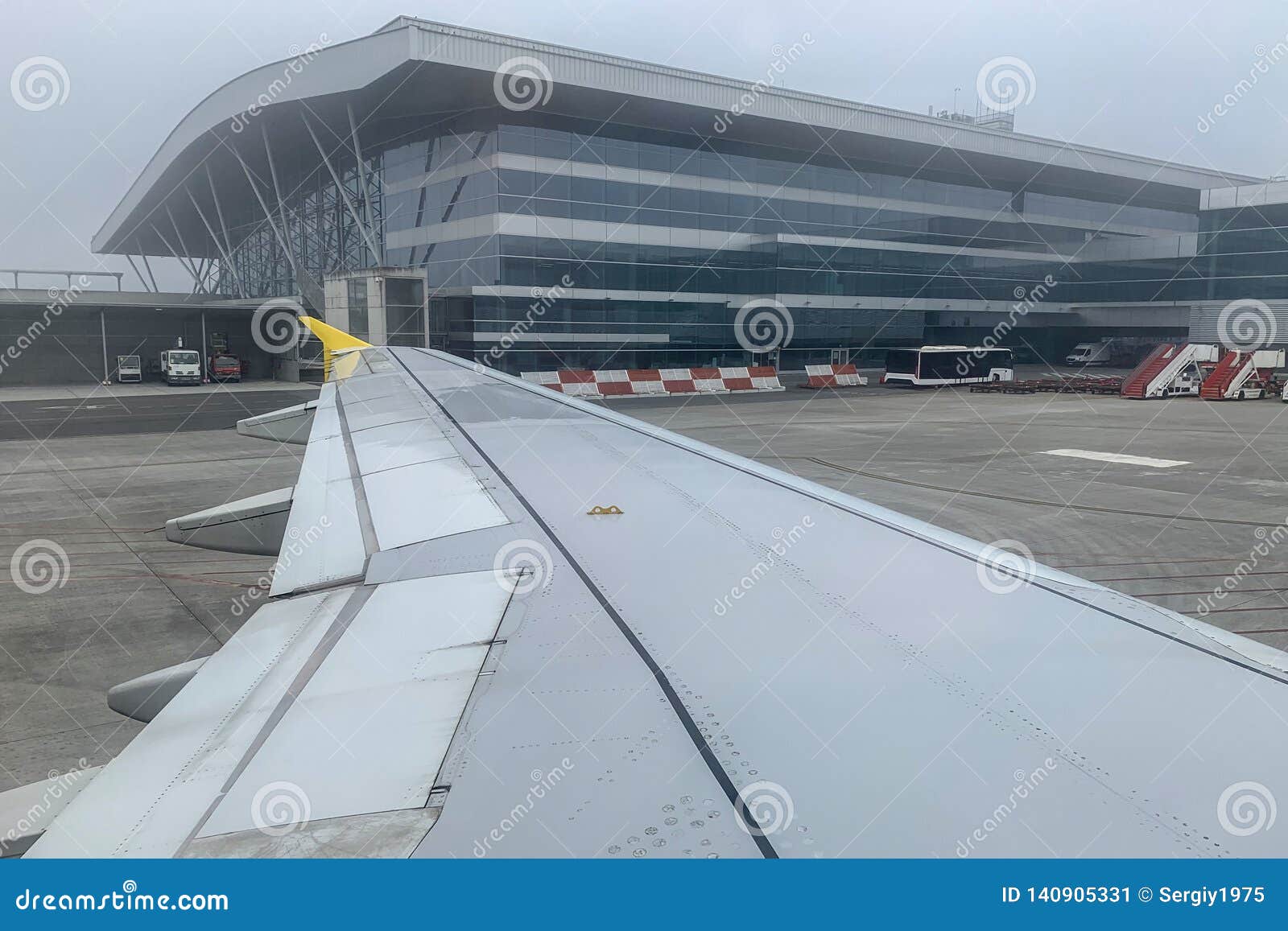 View of the Aircraft Wing from the Porthole Stock Image - Image of ...