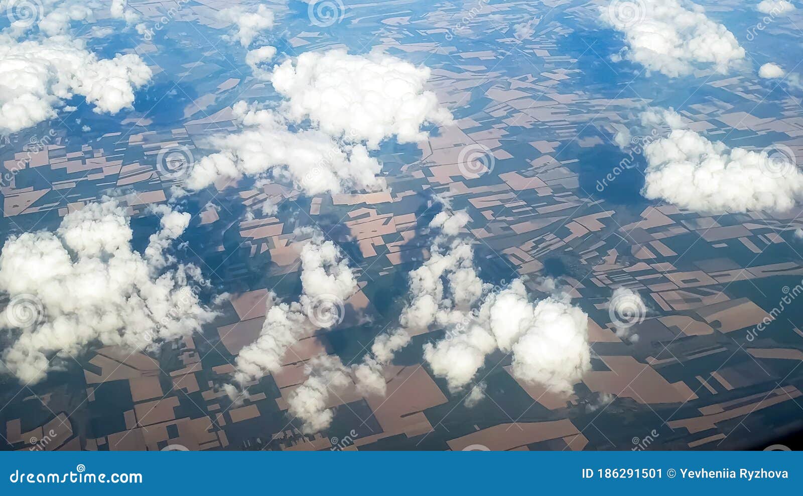View from the Airplane on Clouds Flying Over Fields Stock Image - Image ...