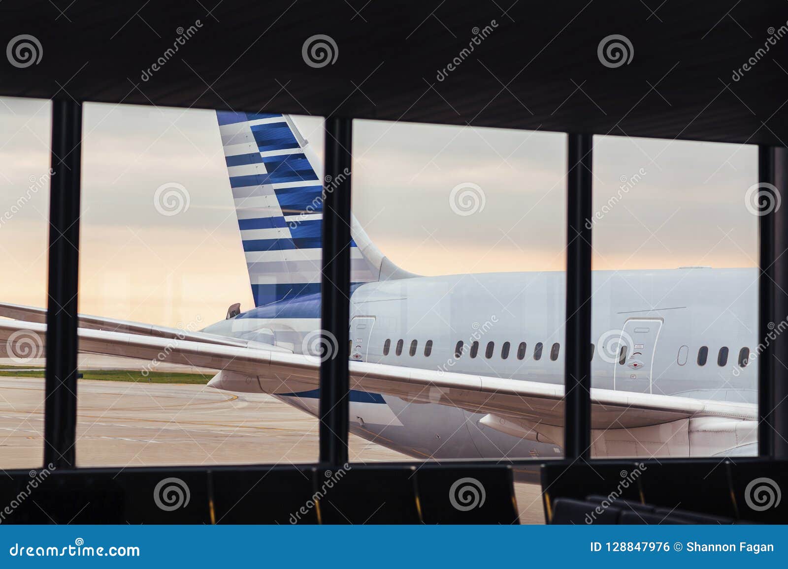 View of Airplane Fuselage Tail through Window at Airport Stock Photo ...