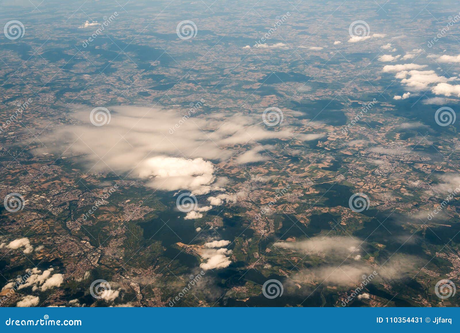 View from Airplane on Ground with Clouds and Fields Stock Image - Image ...