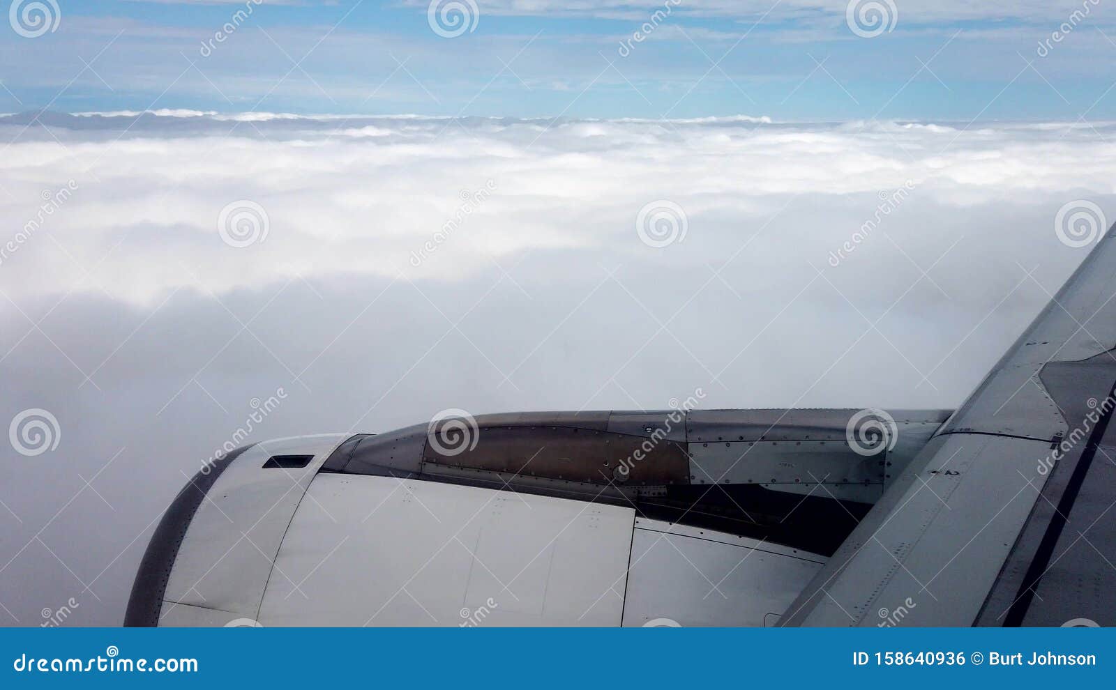 View from Airplane Window Shows Engine and Breaking through Clouds ...