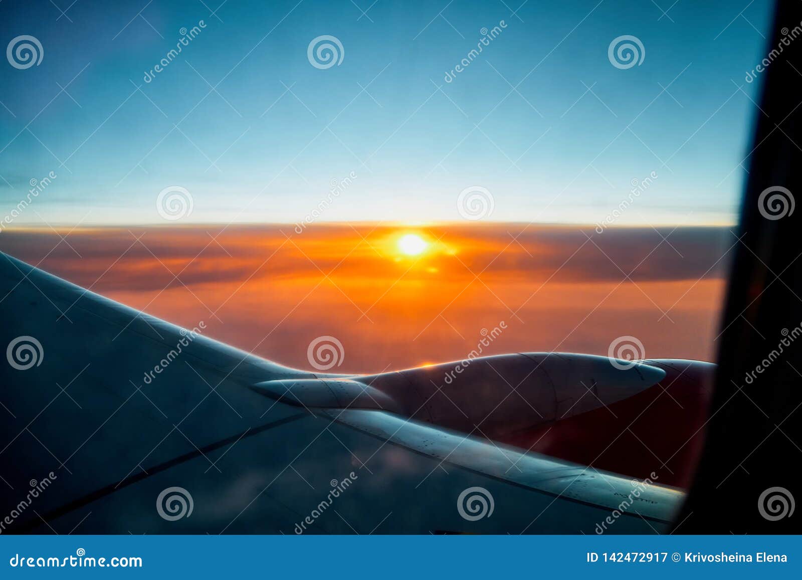 View of Airplane Wing, Sunset and Clouds through Window of Plane Stock ...