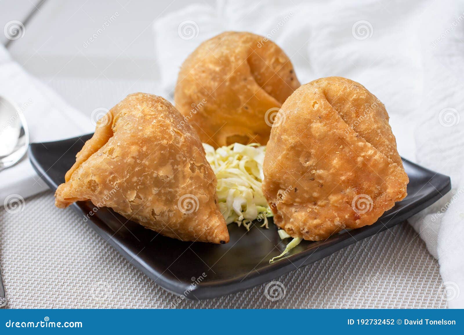 Three samosas stock photo. Image of napkin, retail, copy - 192732452
