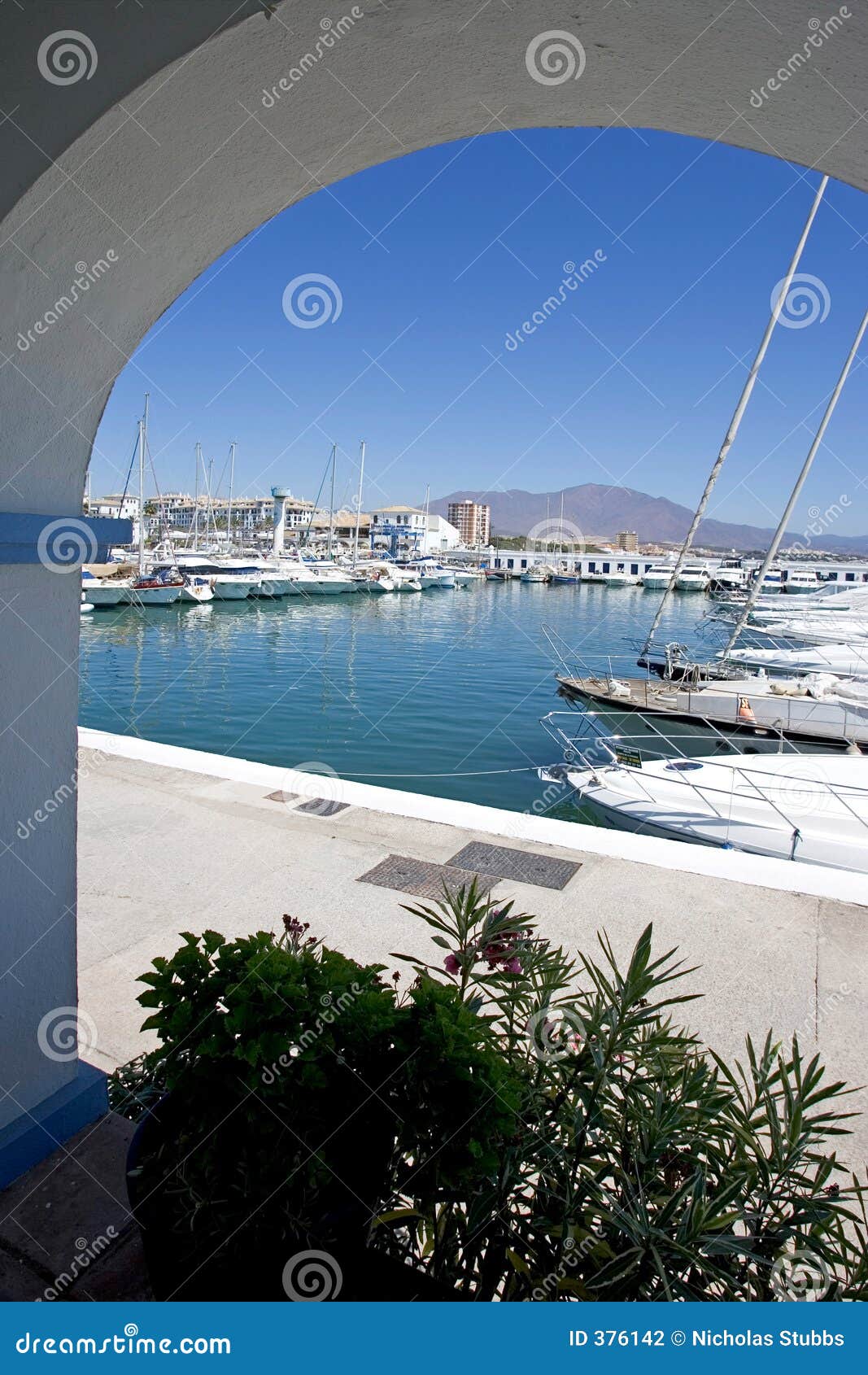 View through Arch To Duquesa Port and Mountains Stock Photo - Image of ...