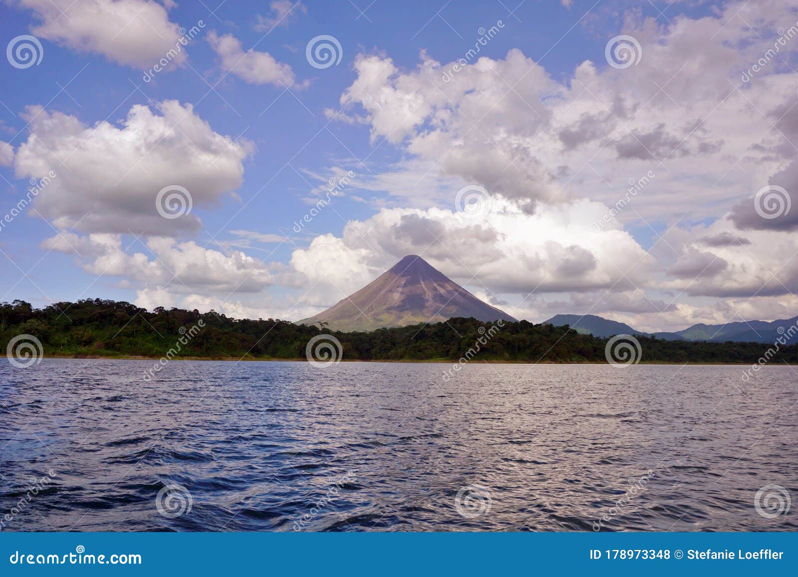 View at the Arenal Volcano from the Arenal Lake Stock Photo - Image of ...