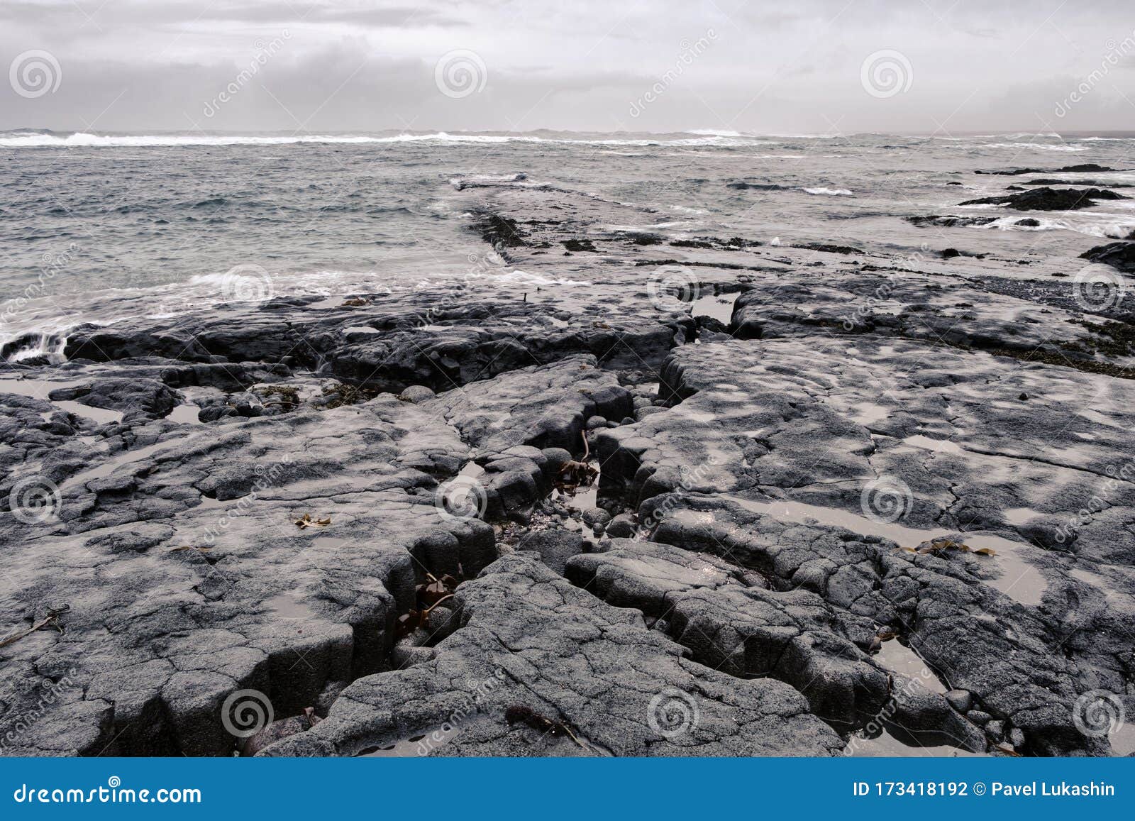 View of the Atlantic Ocean with Cracks on Large Stone Plates in the ...