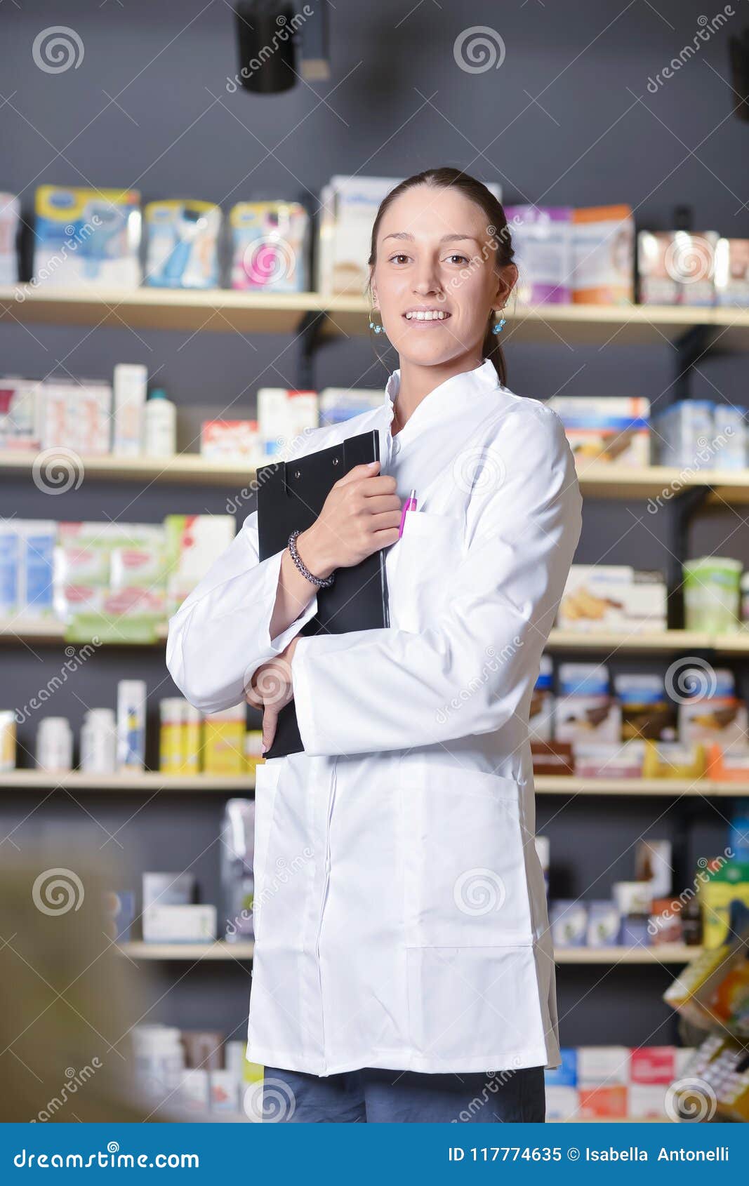 Beautiful Pharmacist Using Notepad at the Pharmacy Stock Image - Image ...